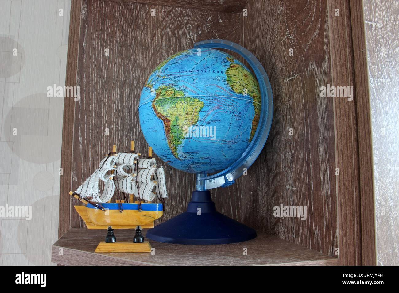 Globe on red stand hi-res stock photography and images - Alamy