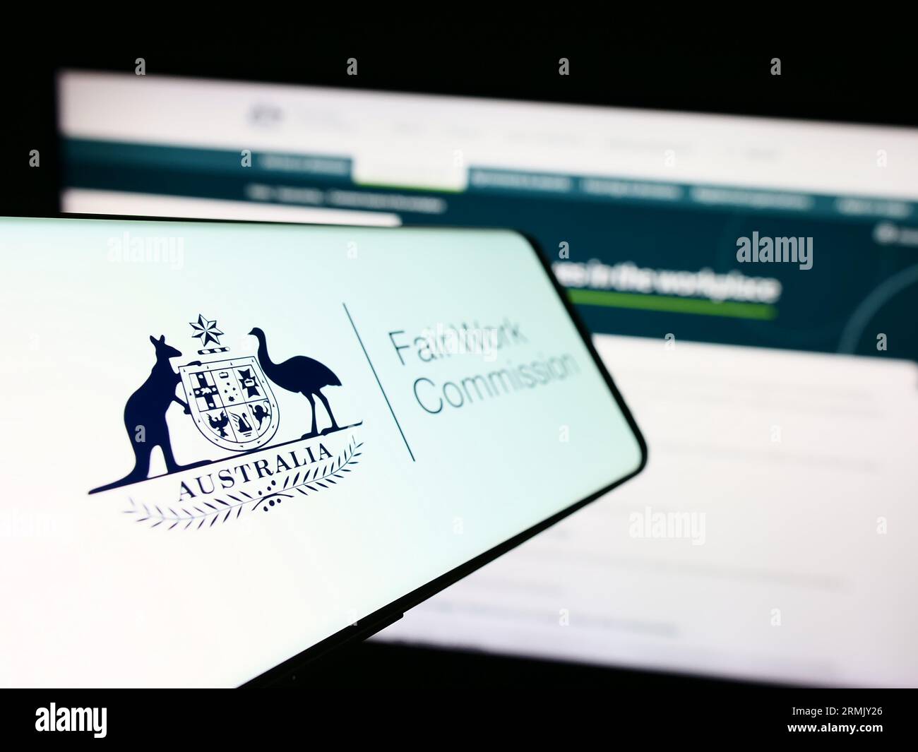 Smartphone with logo of Australian Fair Work Commission (FWC) on screen ...