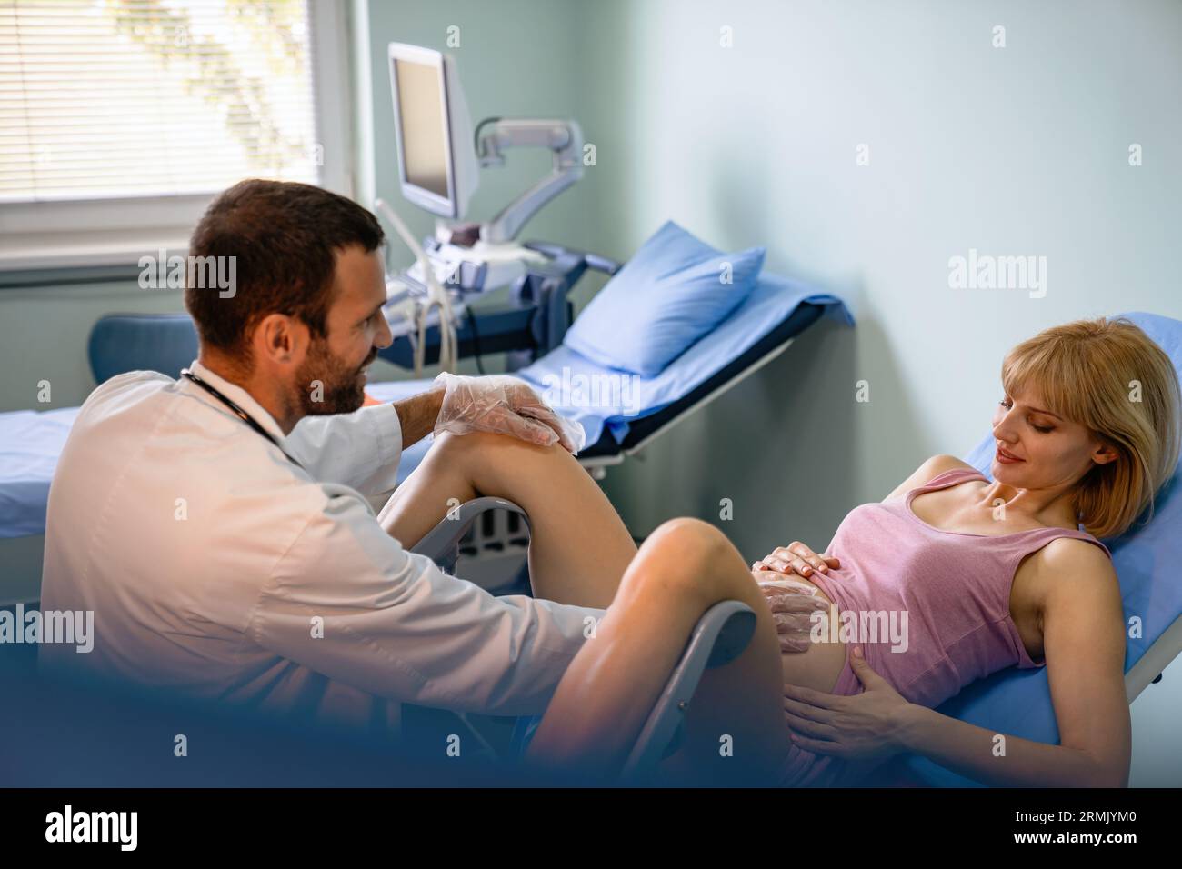 Gynecologist examination woman patient in a gynecological chair. Female ...
