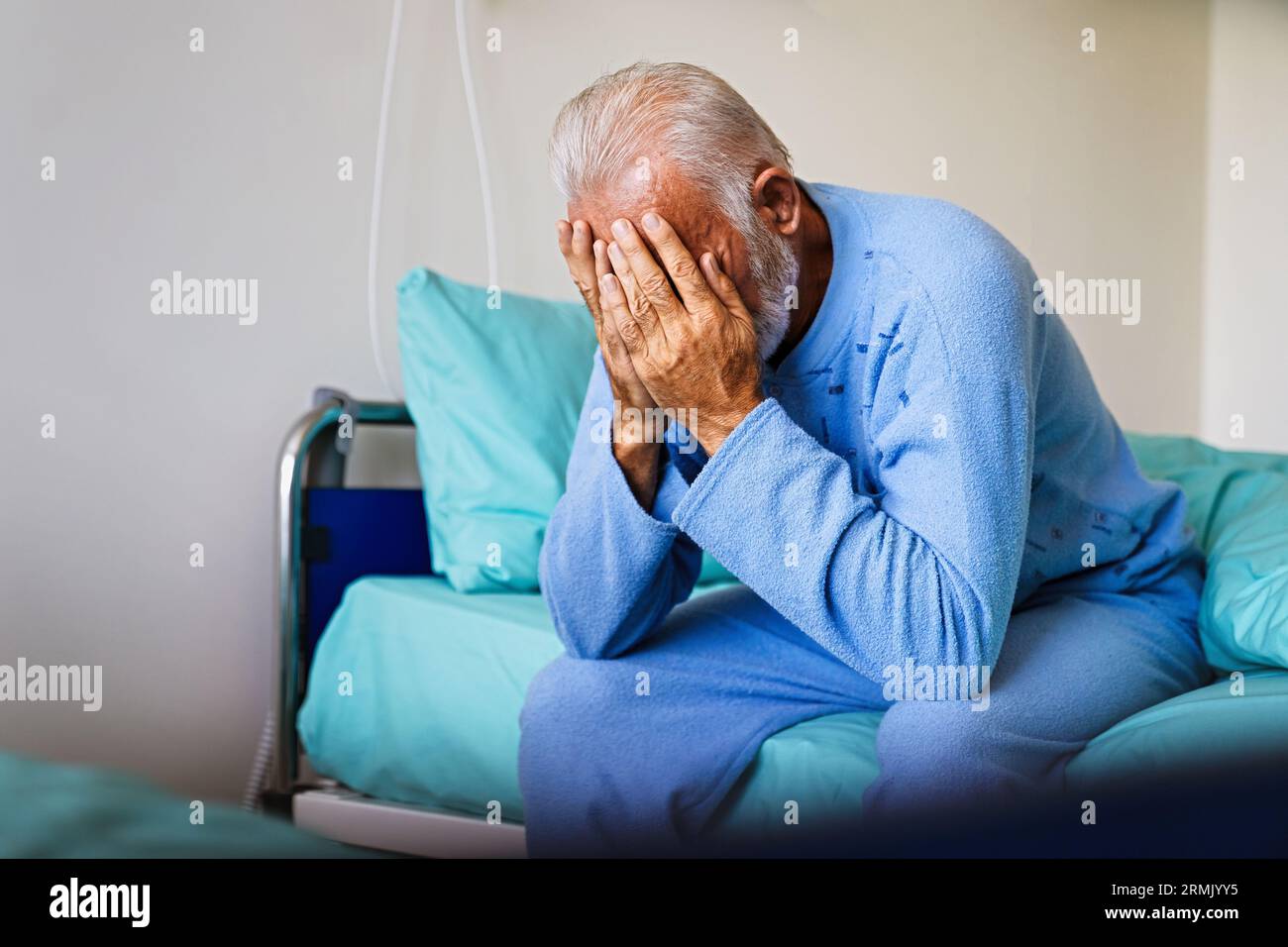 Depressed senior man patient suffering from headache and illness in ...