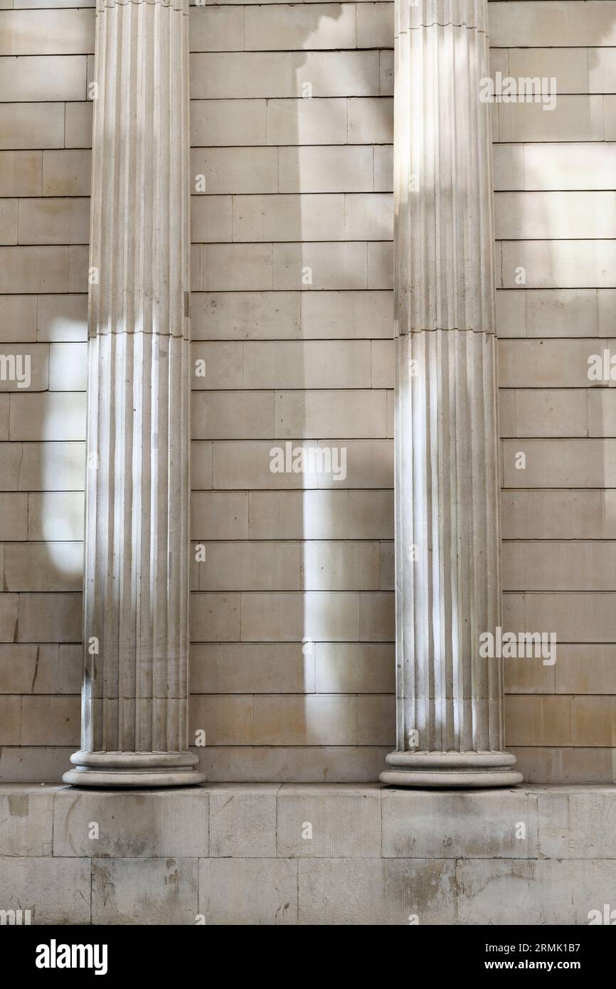 Sunlight being reflected off an office block onto the corinthian columns of the Bank of England ...