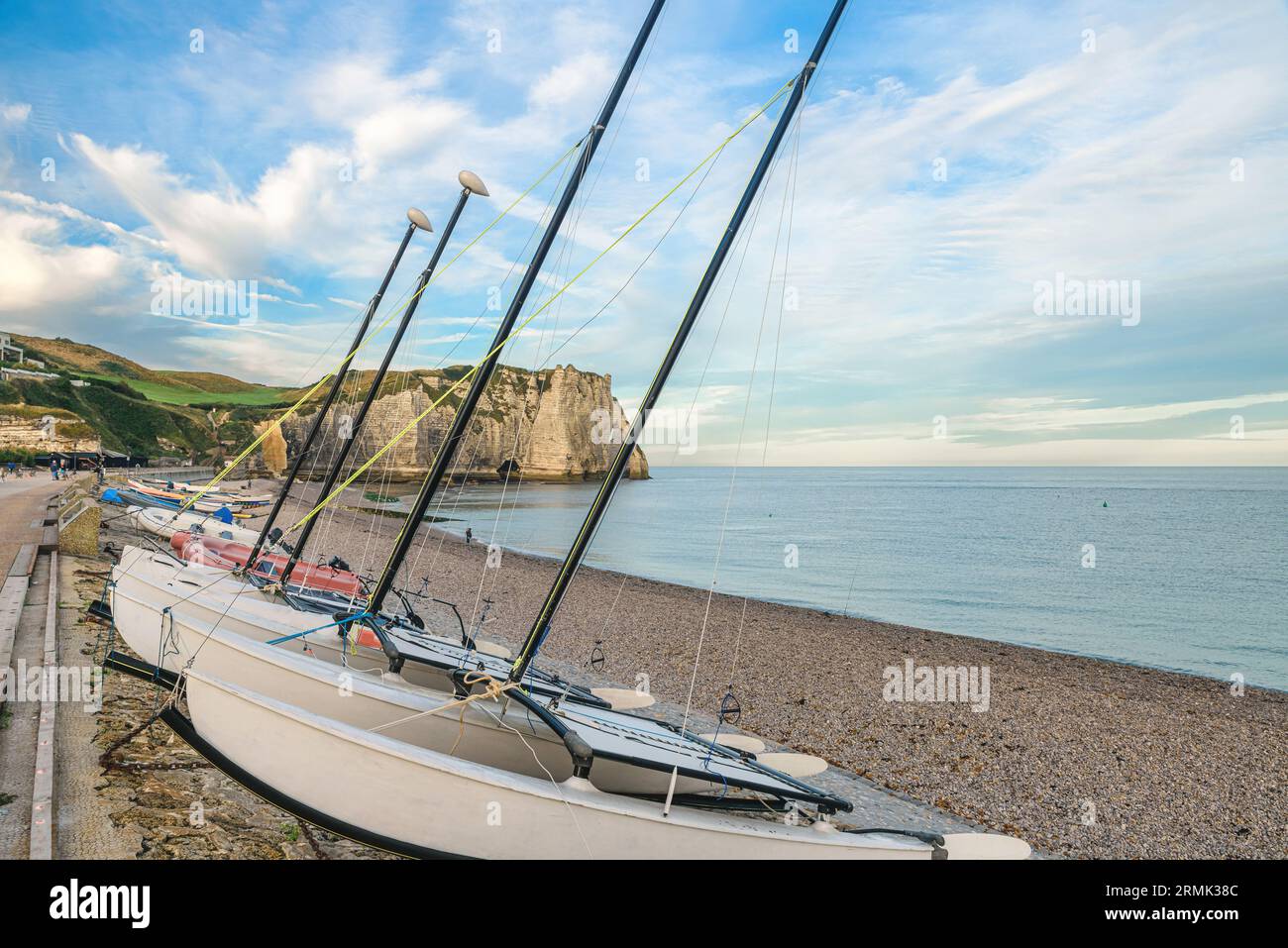 Pebble beach with fishing boats in Etretat, Normandy, France on English ...