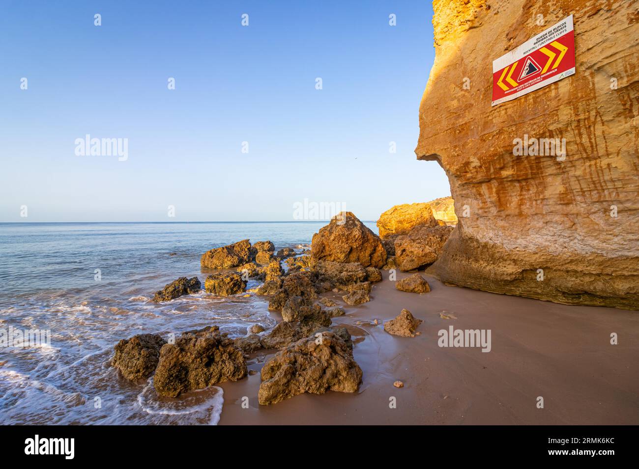 ROCKFALL UNSTABLE CLIFFS, KEEP A SAFE DISTANCE is written in English on ...