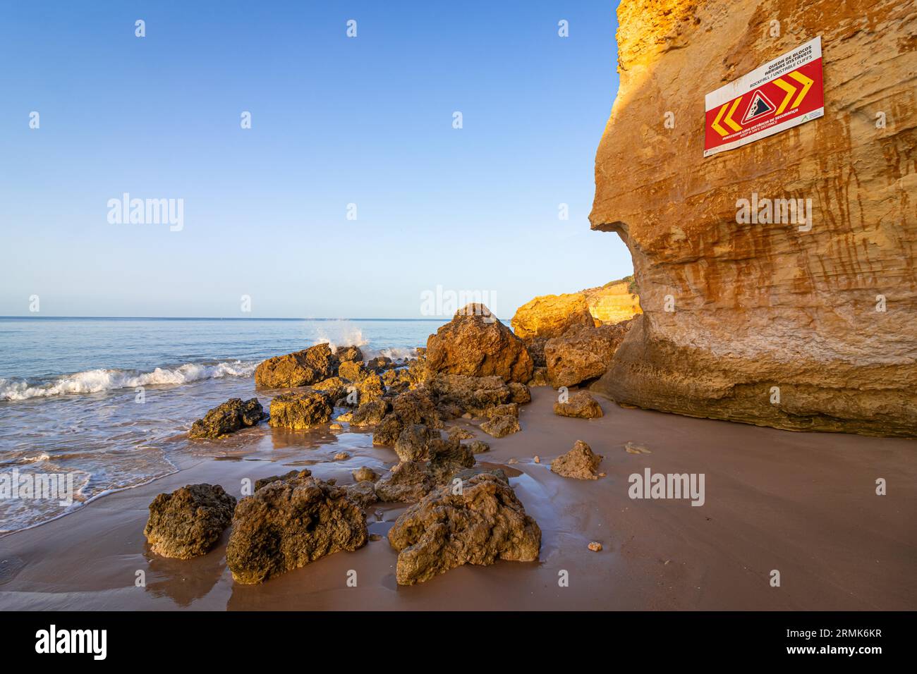 ROCKFALL UNSTABLE CLIFFS, KEEP A SAFE DISTANCE is written in English on ...