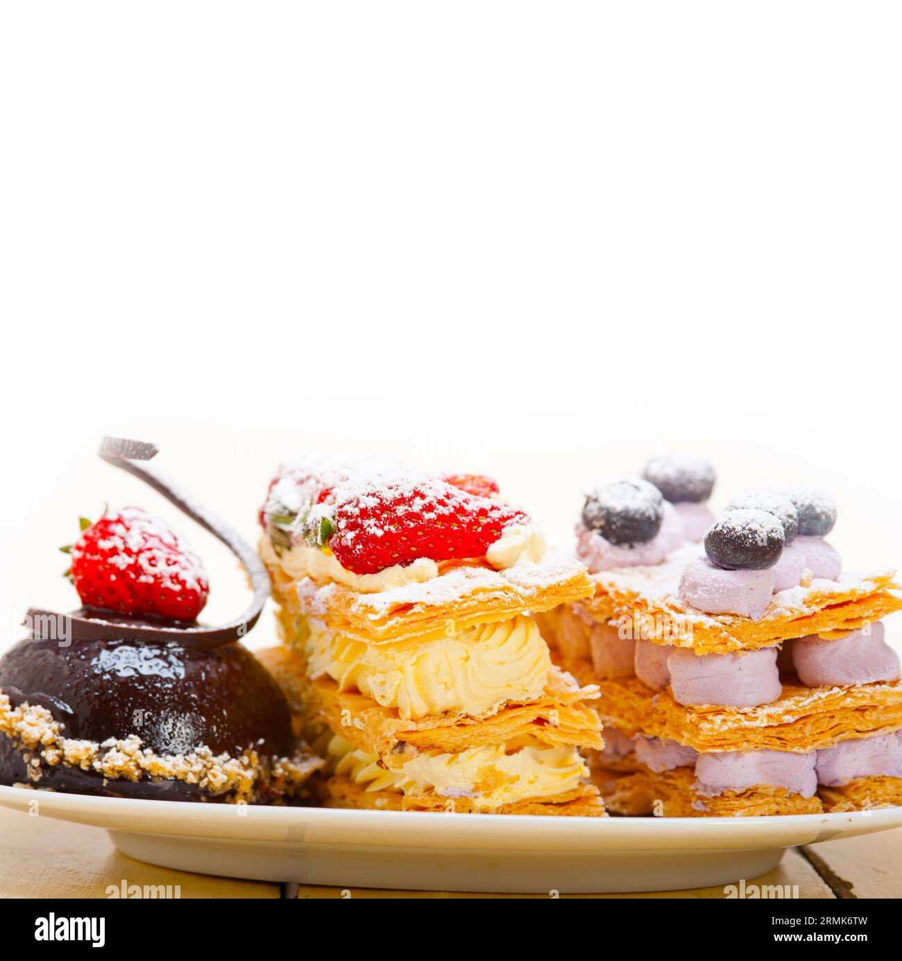 Selection of fresh cream napoleon and chocolate mousse cake dessert ...