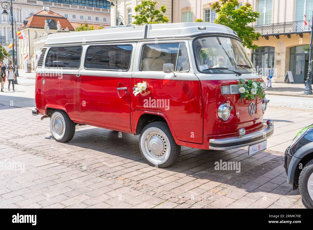 Newlyweds car. Red minibus volkswagen. Retro bus car. Decorated with ...