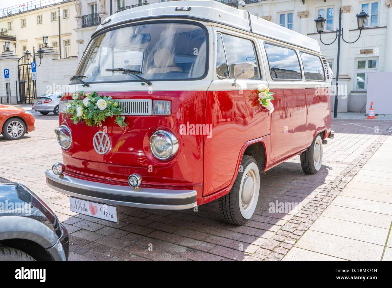 Newlyweds car. Red minibus volkswagen. Retro bus car. Decorated with ...