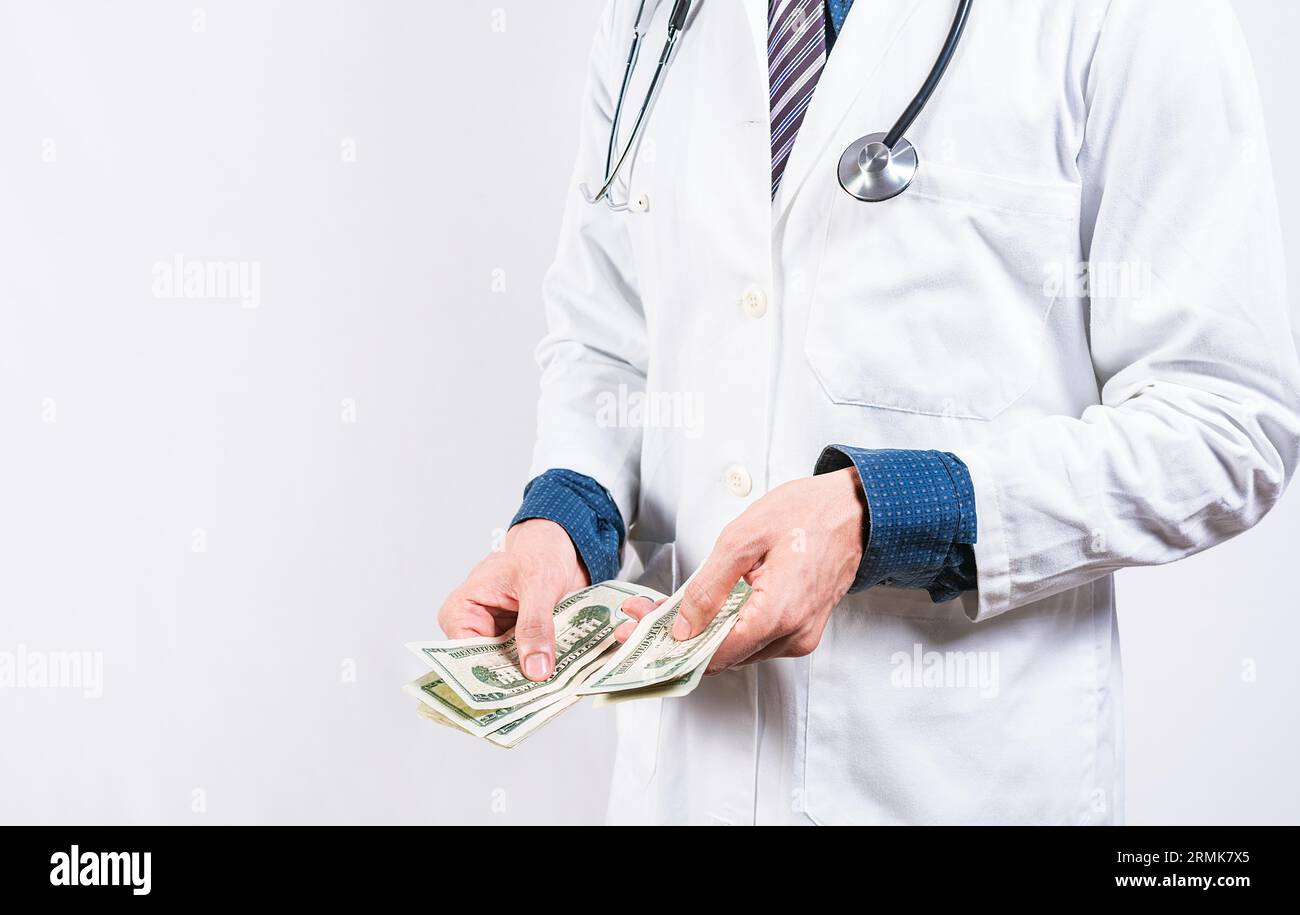 Medical doctor counting money concept hi-res stock photography and ...
