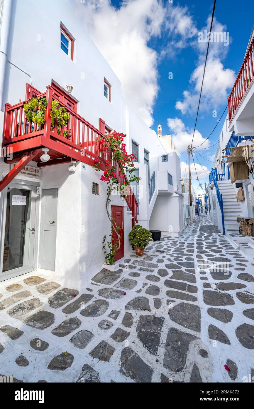 Cycladic white houses with colourful doors and shutters, alleys of the ...