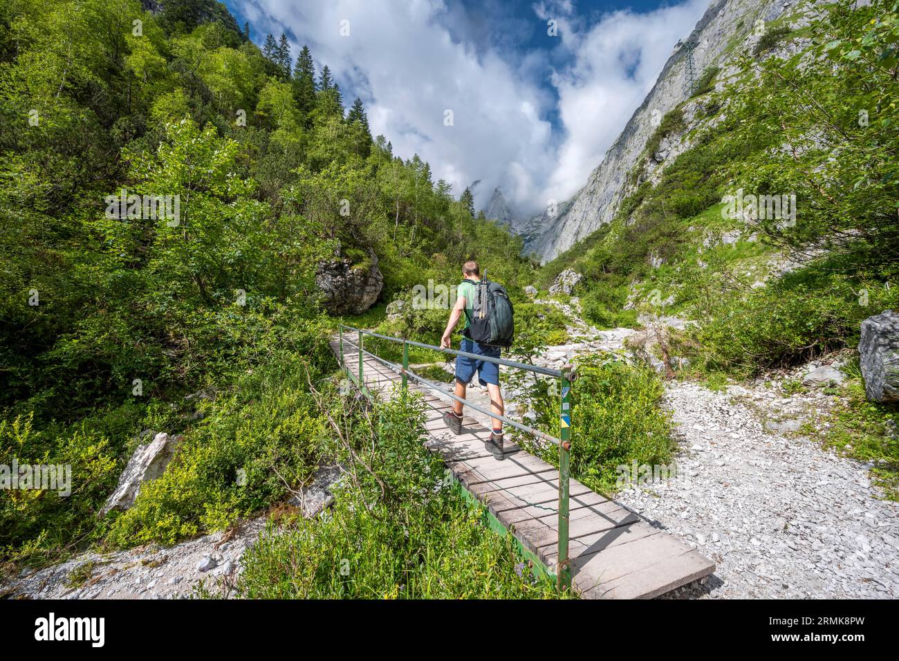 Mountaineer on bridge over the Hammersbach, at the end of the ...