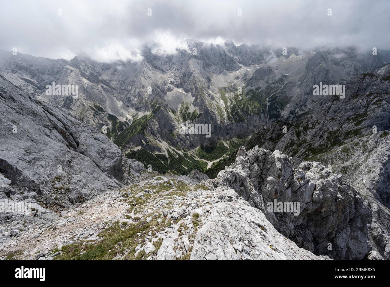 View from the summit of the Waxenstein over rocky and narrow ridge of ...