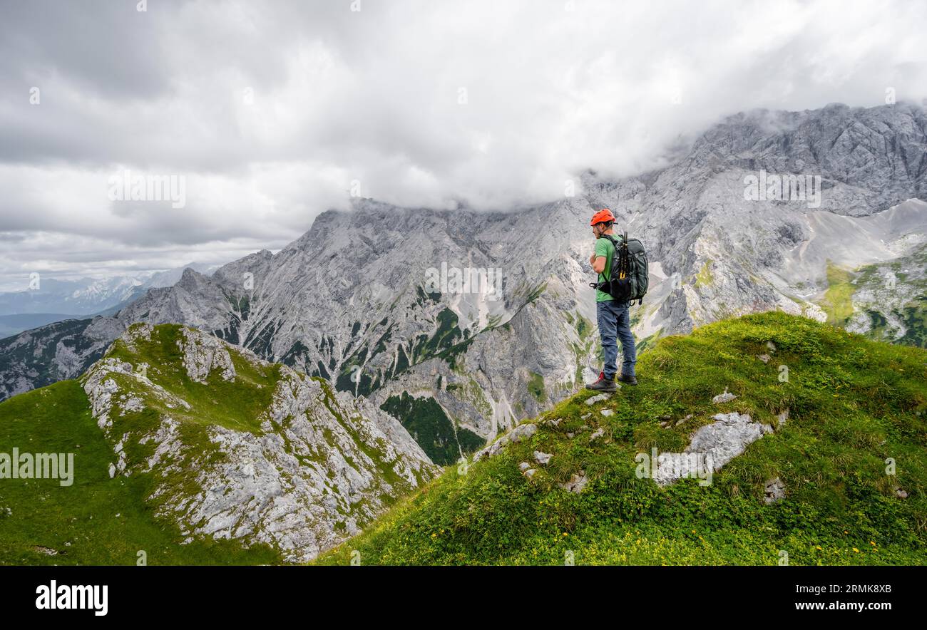 Mountaineer in steep terrain on the Schafsteig on the Waxenstein ridge ...