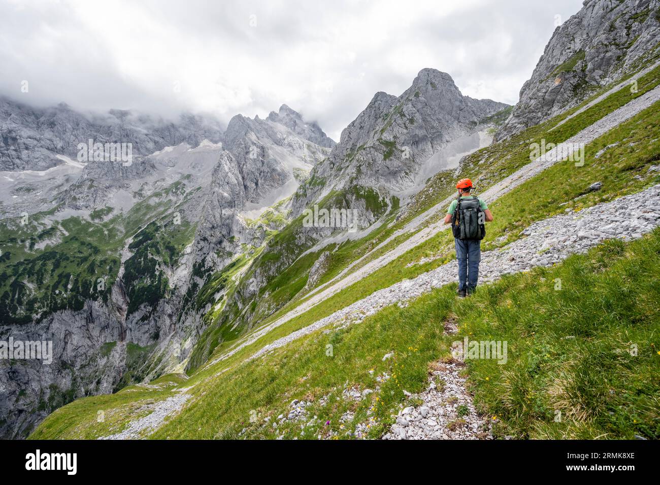 Mountaineer in steep terrain on the Schafsteig on the Waxenstein ridge ...
