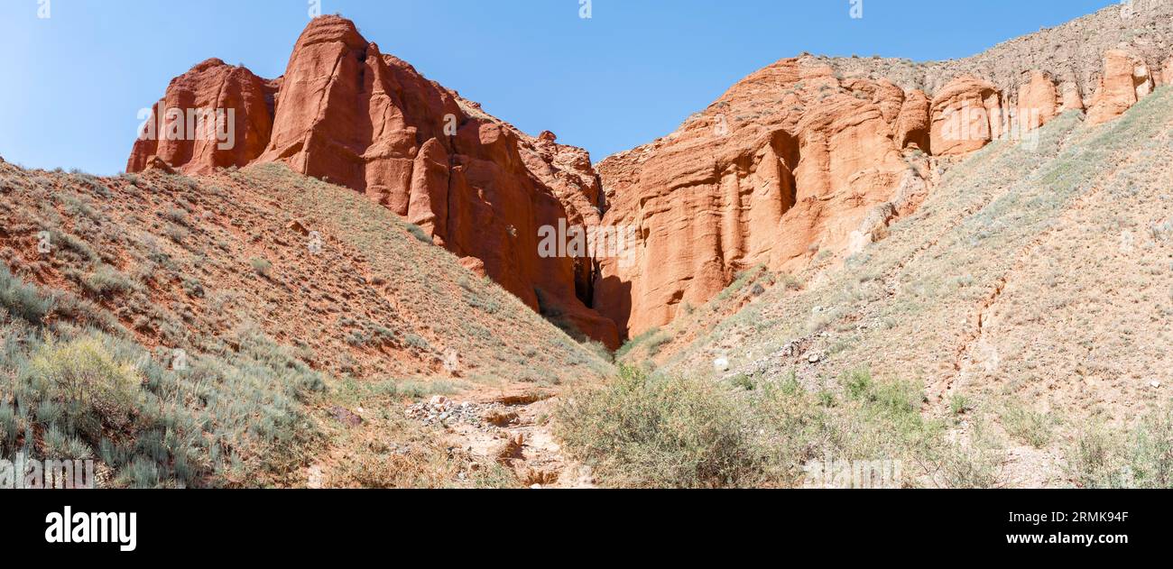 Rock formations of eroded red sandstone, near Konorchek Canyon, Chuy ...