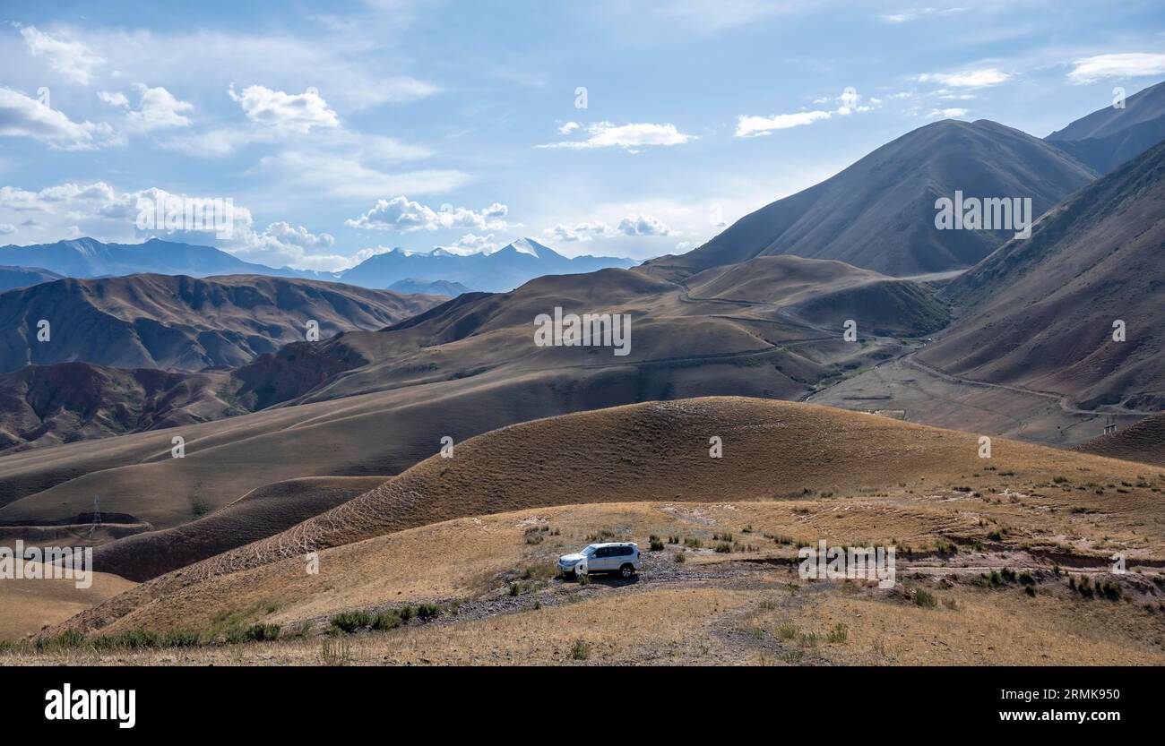 Toyota Land Cruiser four-wheel drive vehicle on a dirt road, view over ...