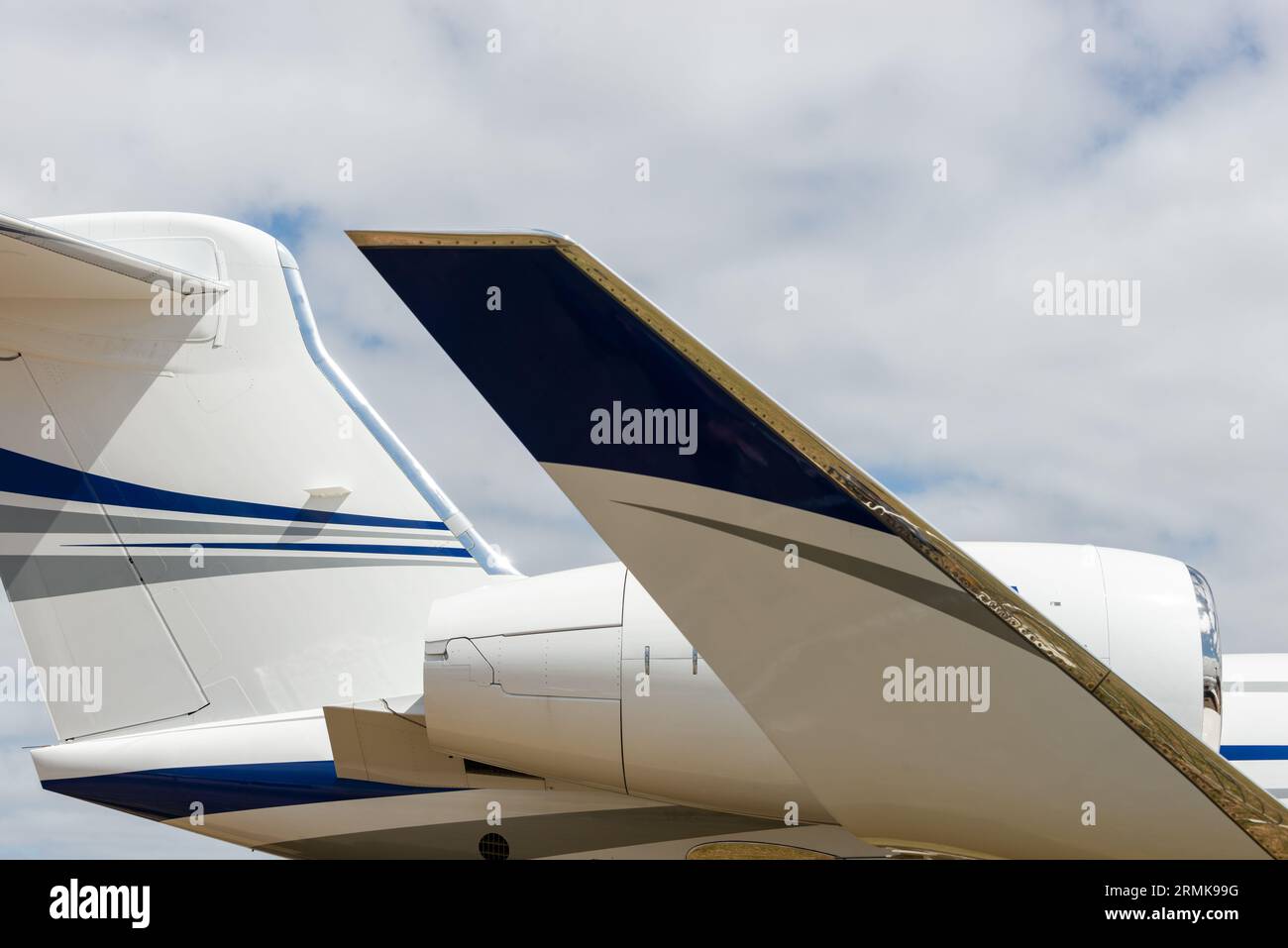 White and blue private jet, tail wing and fuselage Stock Photo - Alamy