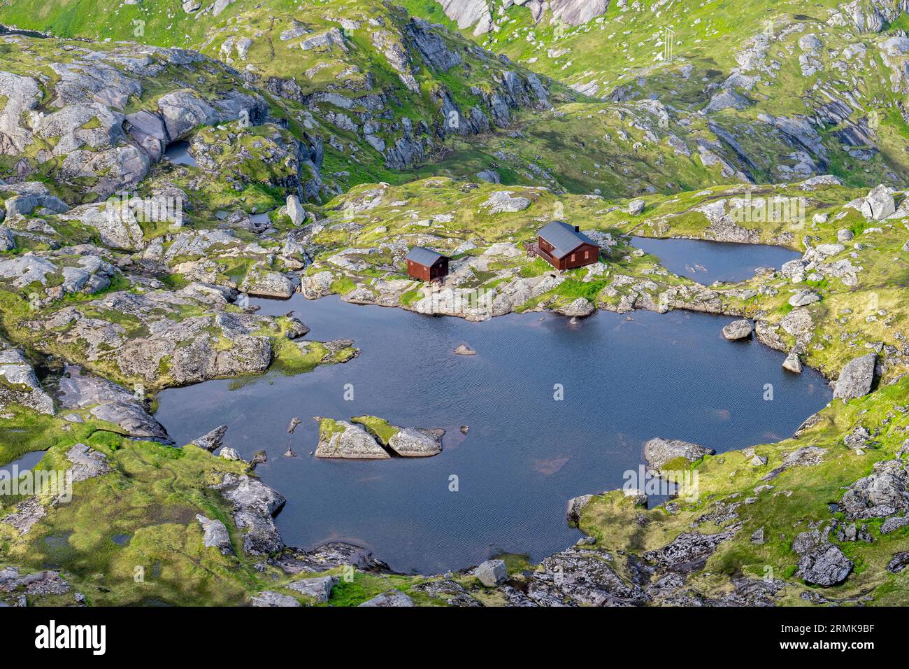 Mountain landscape with Munkebu mountain hut and small lakes, view from ...
