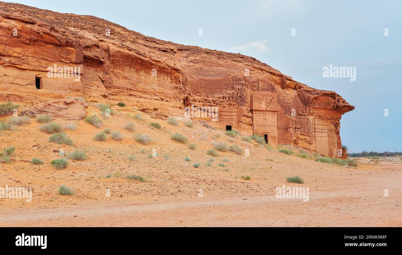 Old Nabatean architecture carved on orange sandstone wall at Jabal Al ...