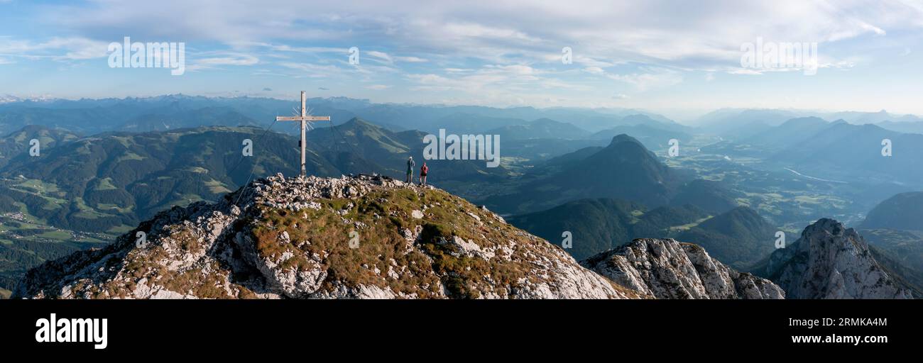 Alpine panorama, Two hikers at the summit, Aerial view, Evening ...