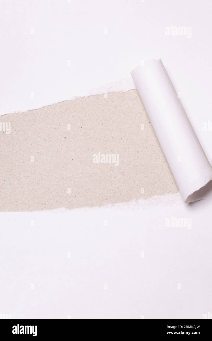 Torn paper with opening showing cardboard paper background Stock Photo ...