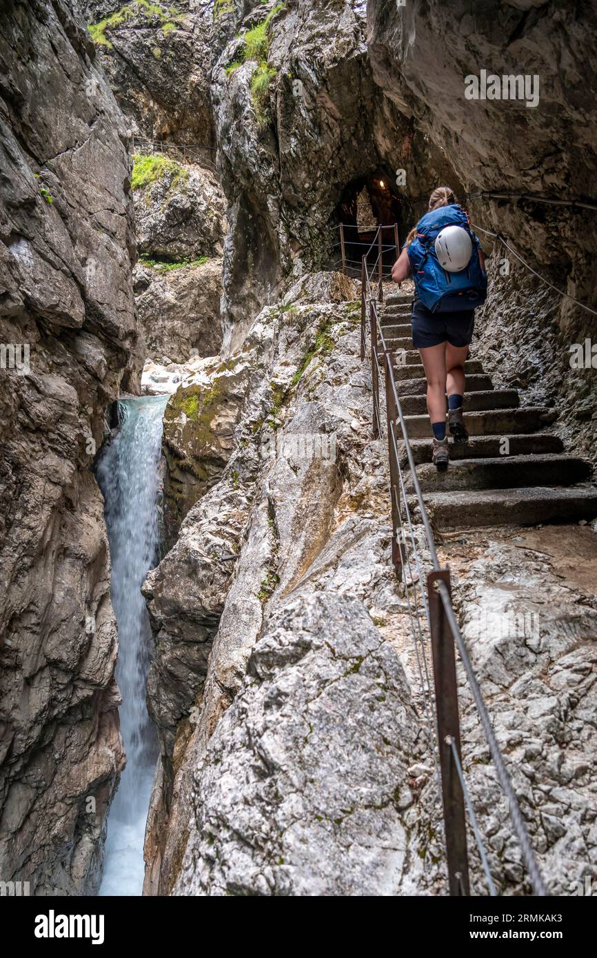 Hiker in a gorge, Hammersbach flows through Hoellentalklamm, near ...