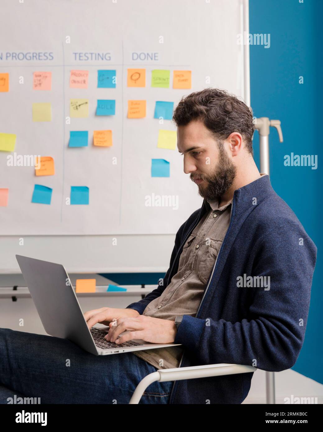 Bearded man working laptop Stock Photo - Alamy