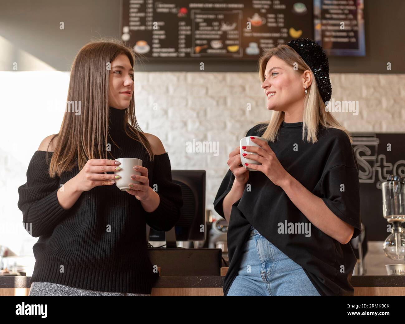 Best friends reunited coffee shop Stock Photo - Alamy