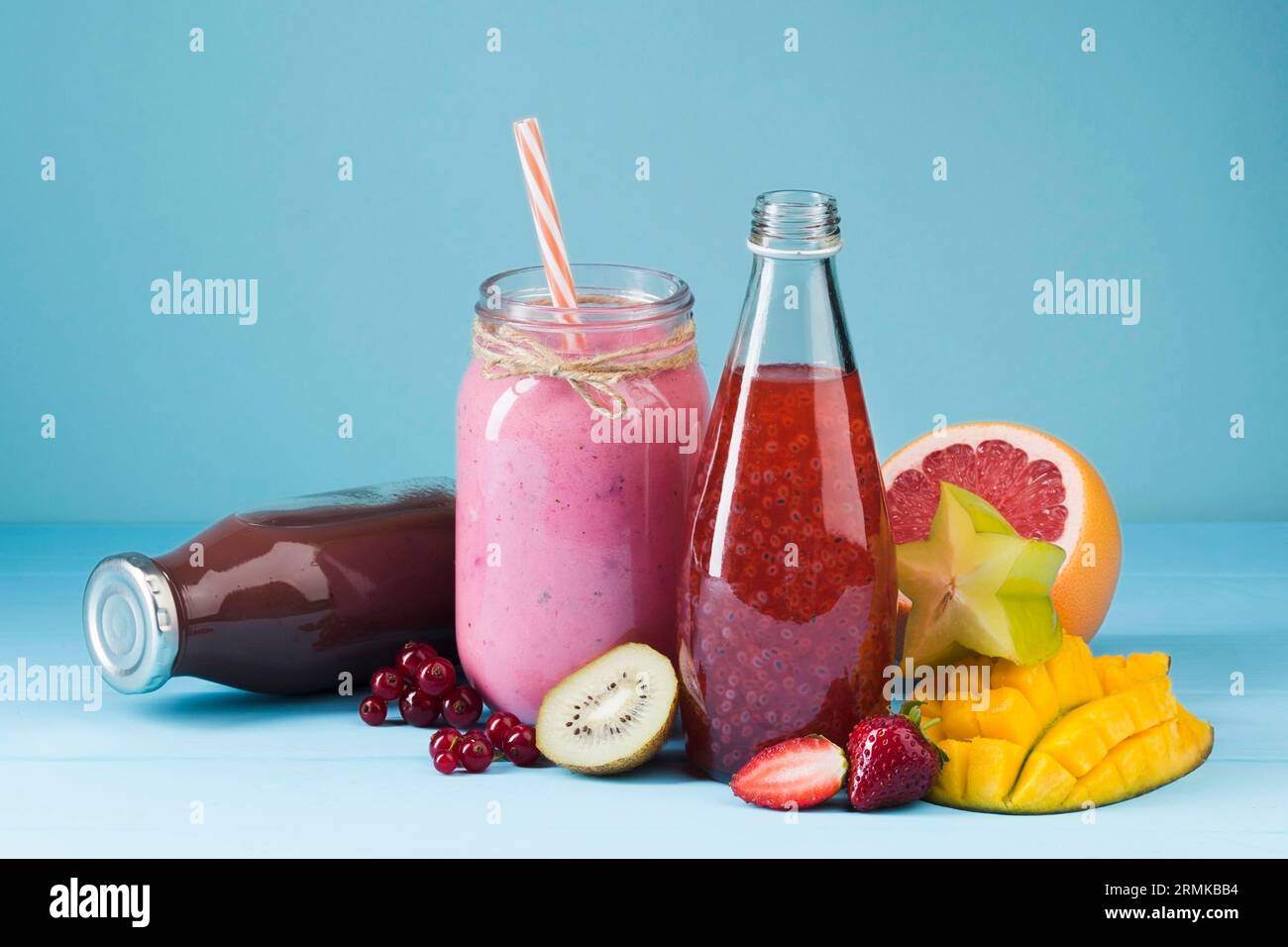 Colorful smoothie bottles fruit Stock Photo - Alamy