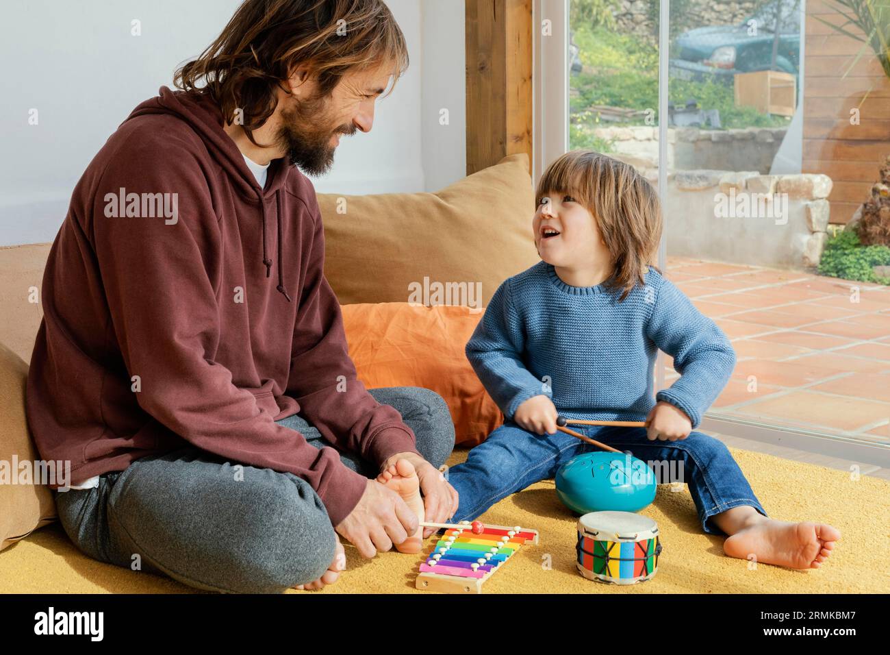 Father son playing together Stock Photo - Alamy