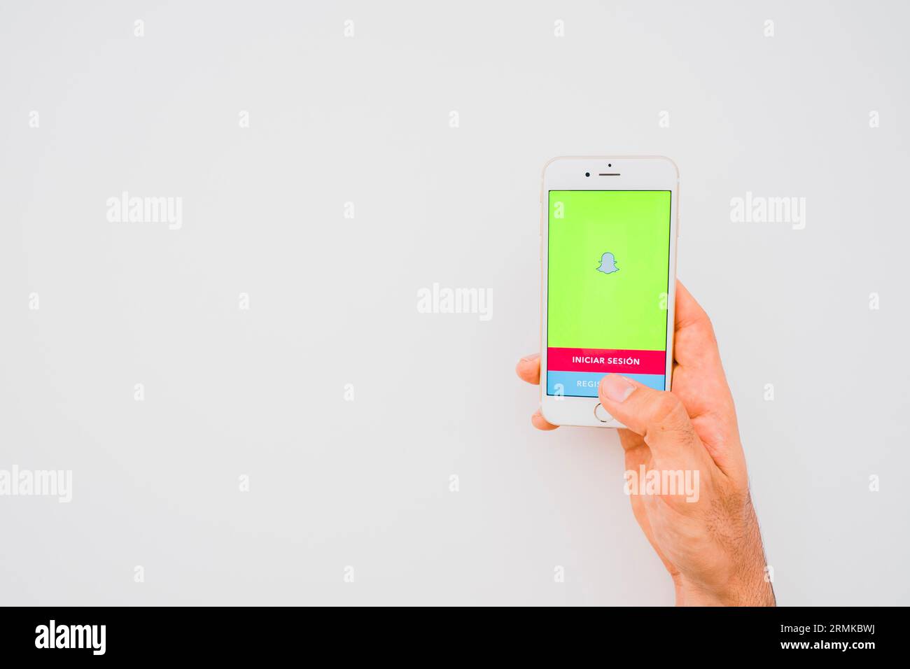 Hand holding phone with snapchat copy space Stock Photo - Alamy
