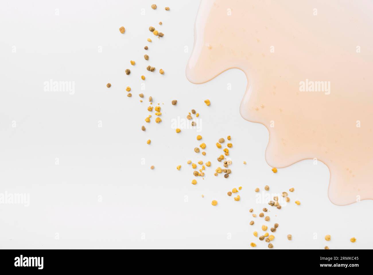 High angle view honey bee pollen seeds white background Stock Photo - Alamy