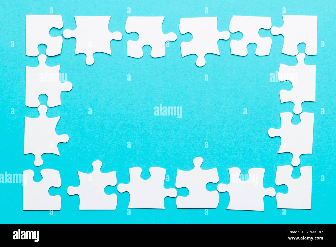 High angle view jigsaw puzzle frame blue backdrop Stock Photo - Alamy