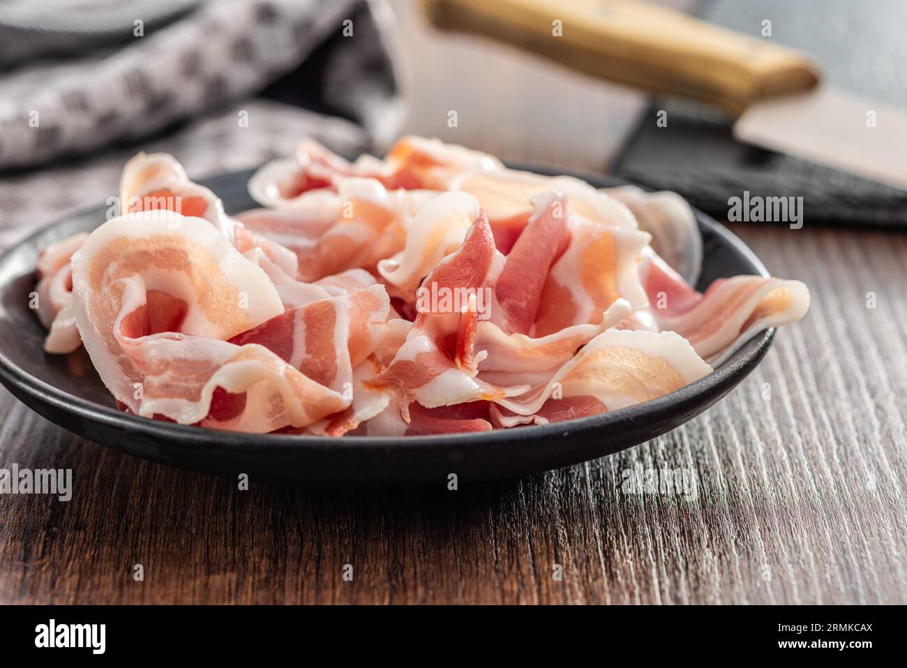 Italian panchetta. Sliced smoked bacon on the plate Stock Photo - Alamy