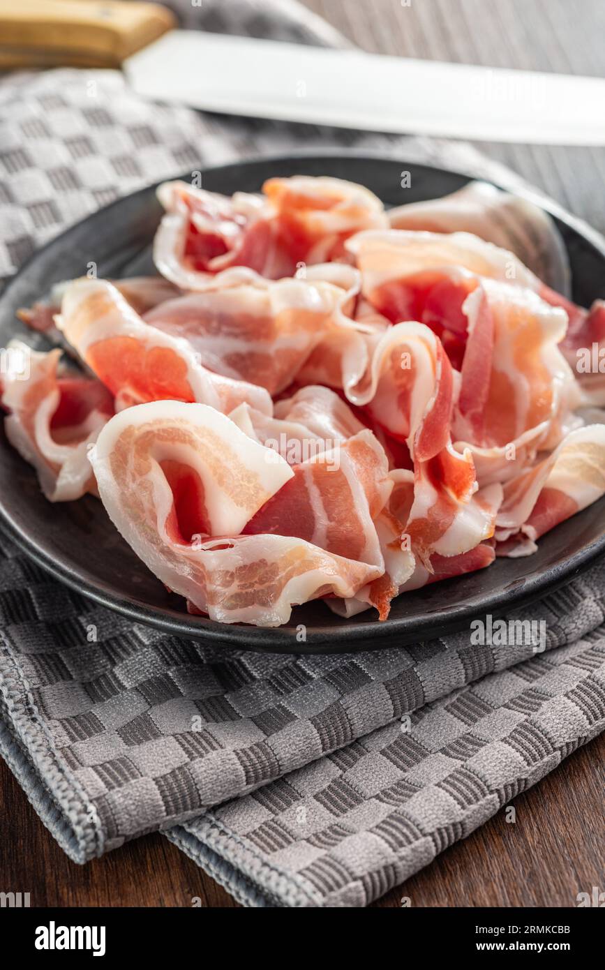 Italian panchetta. Sliced smoked bacon on the plate Stock Photo - Alamy