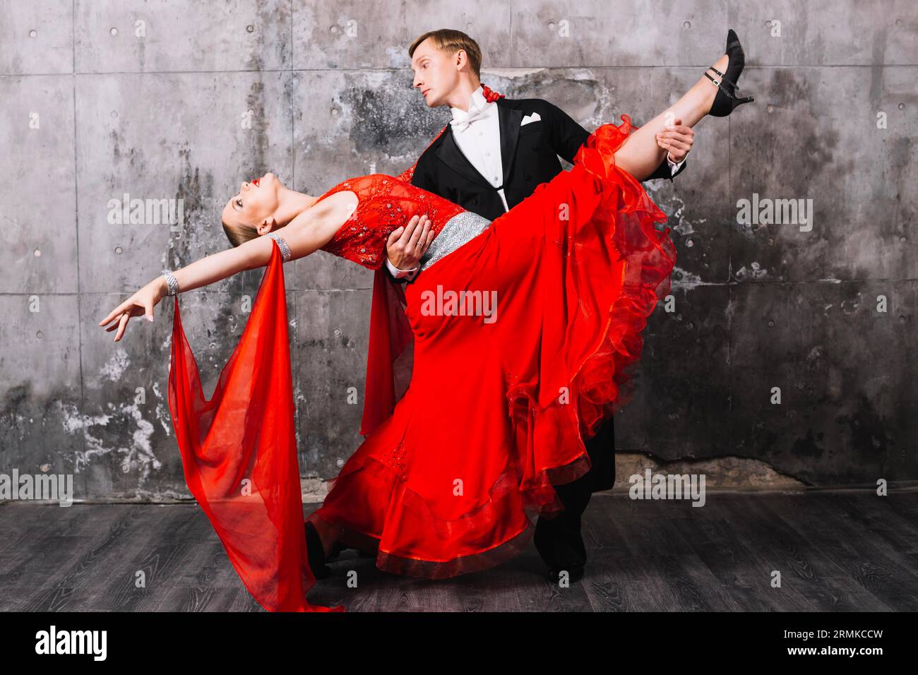Man holding woman during dance Stock Photo - Alamy