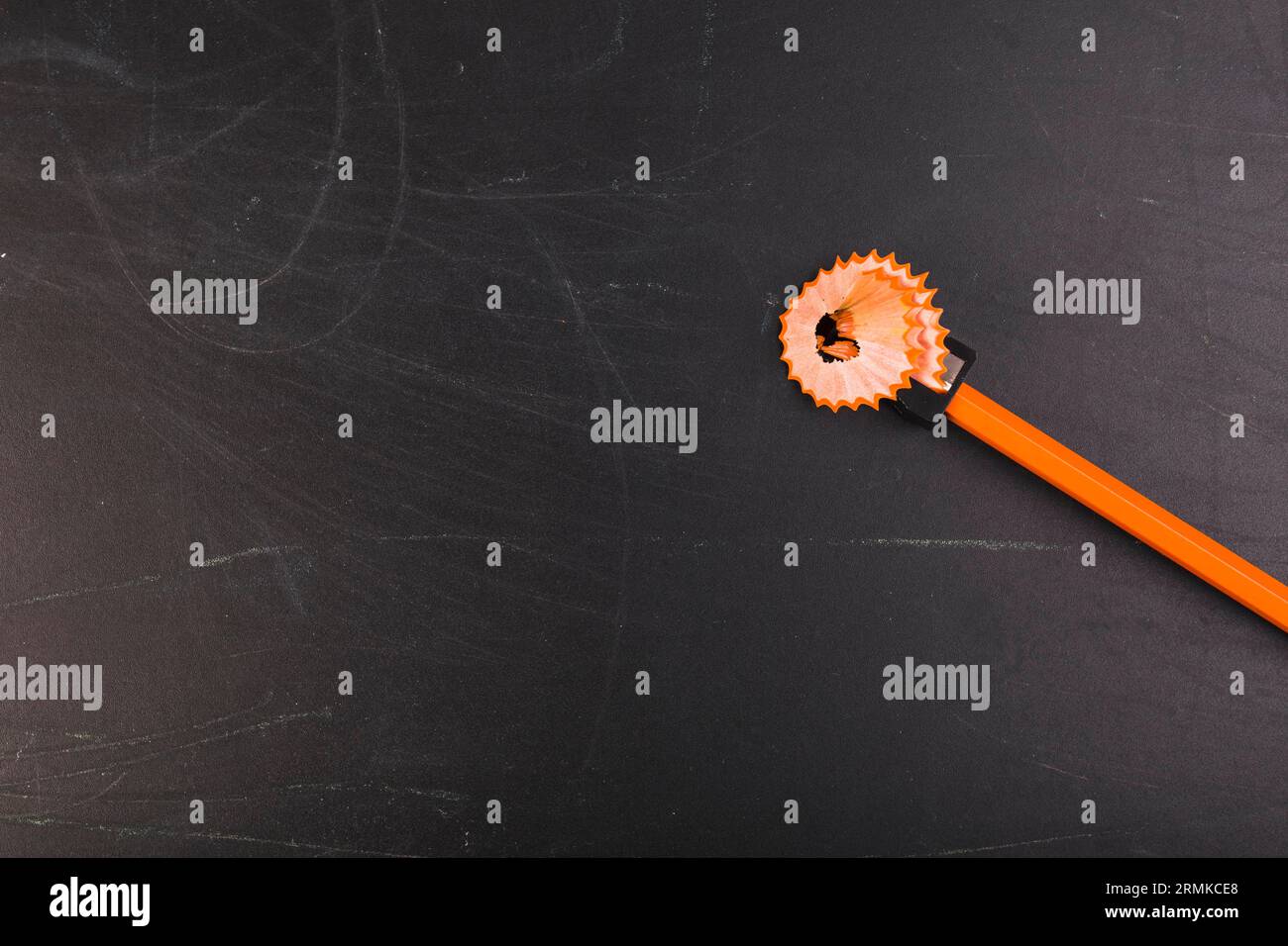 Orange pencil sharpening Stock Photo - Alamy
