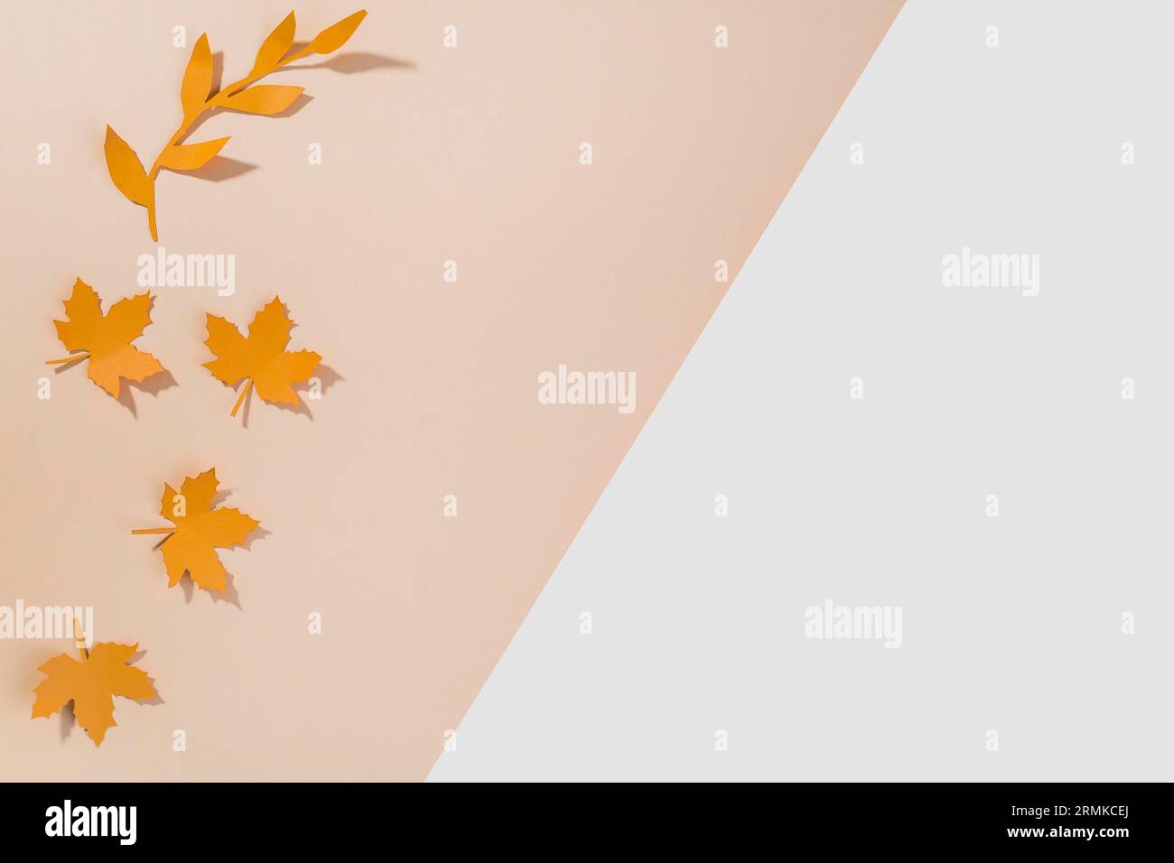 Orange paper leaflets table Stock Photo - Alamy