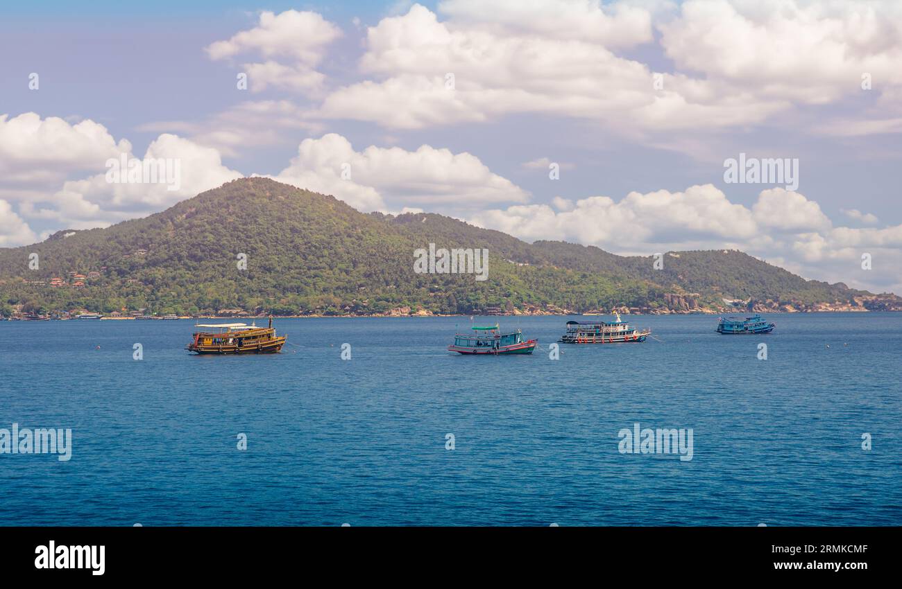 Dive boats anchored offshore for tourists in front of Ko Tao Island in ...