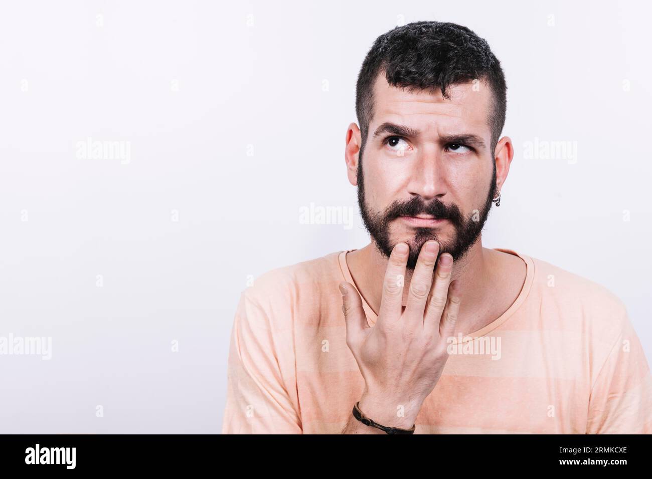 Serious man thinking looking up Stock Photo - Alamy