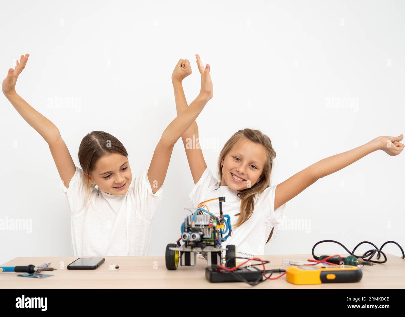 Smiley girls doing science experiments Stock Photo - Alamy