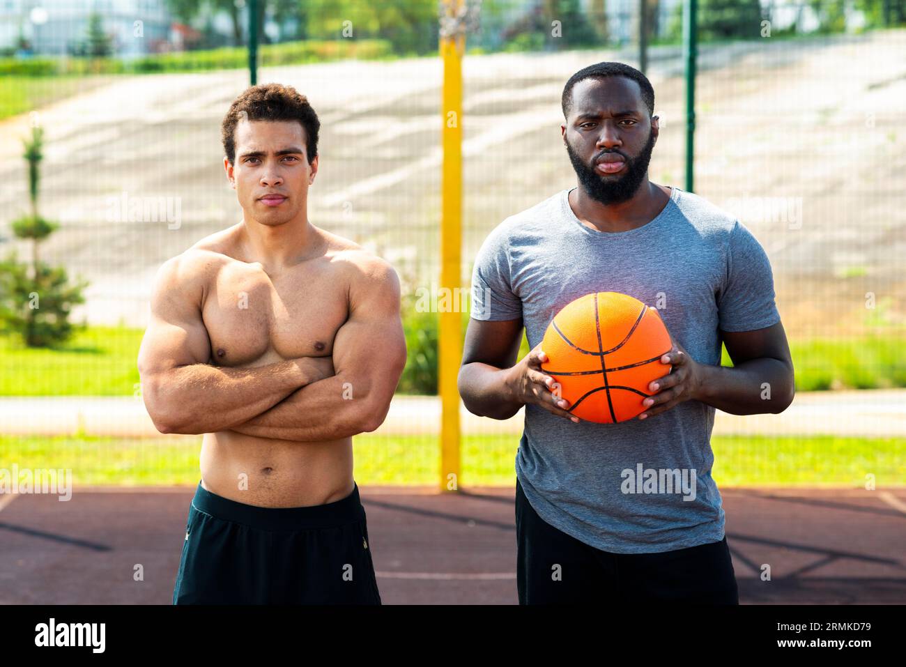 Tall men looking camera medium shot Stock Photo - Alamy