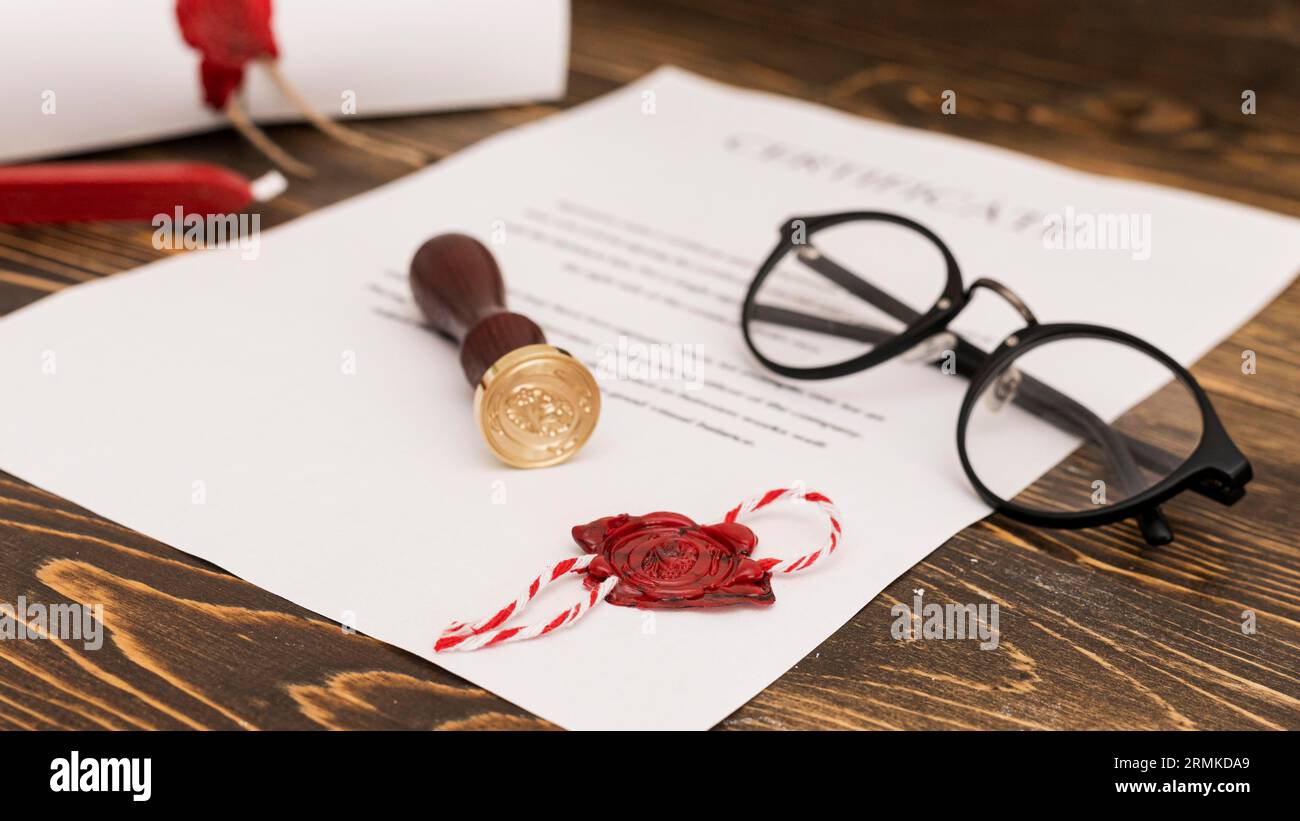 Using wax seal graduation diploma certificate Stock Photo - Alamy
