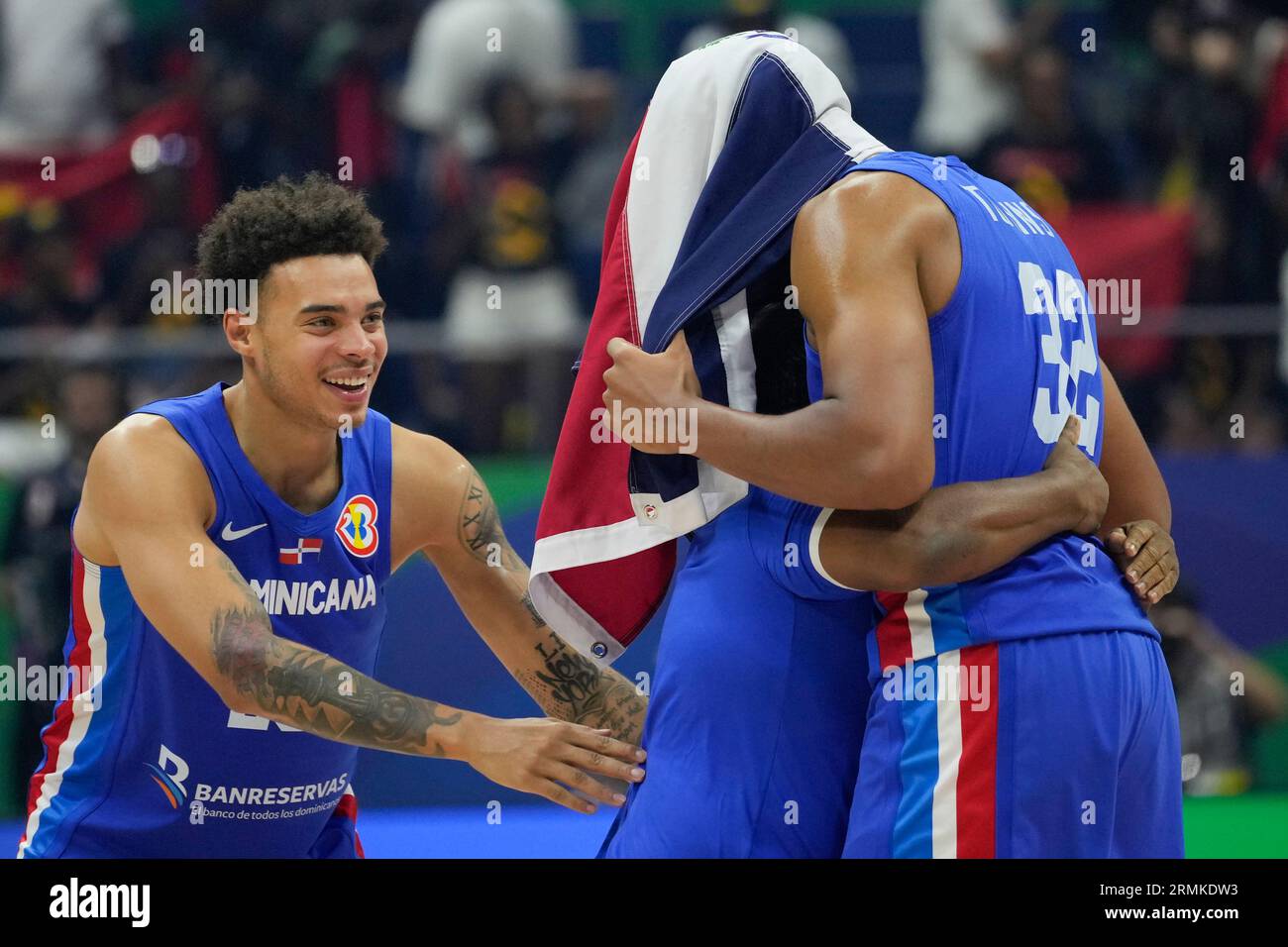 Dominican Republic team celebrates after winning against Angola during ...