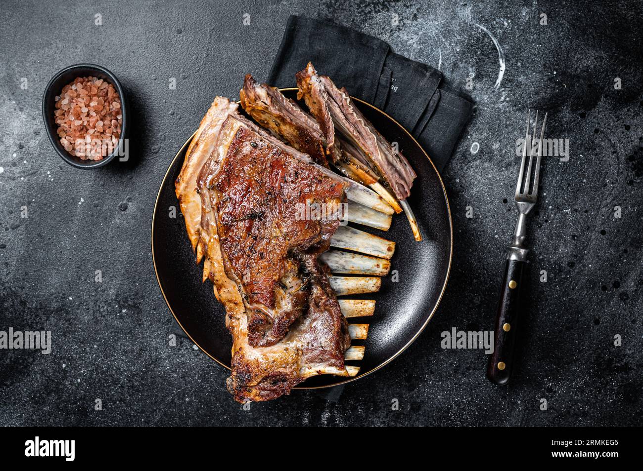 Roasted Rack of lamb ribs, mutton spareribs, sliced meat on plate ...