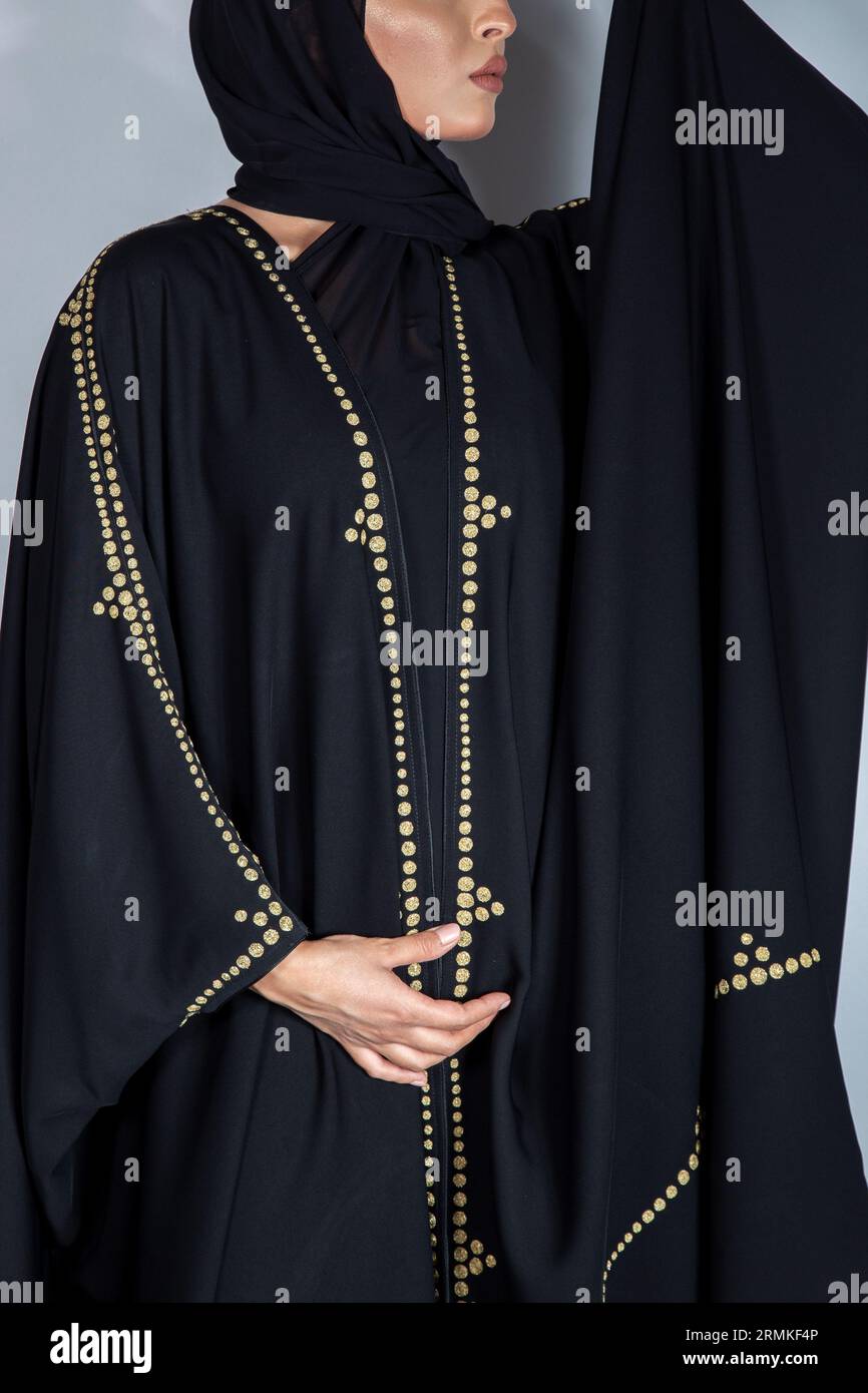 Asian Model poses for Arabic designer Abaya on isolated background ...