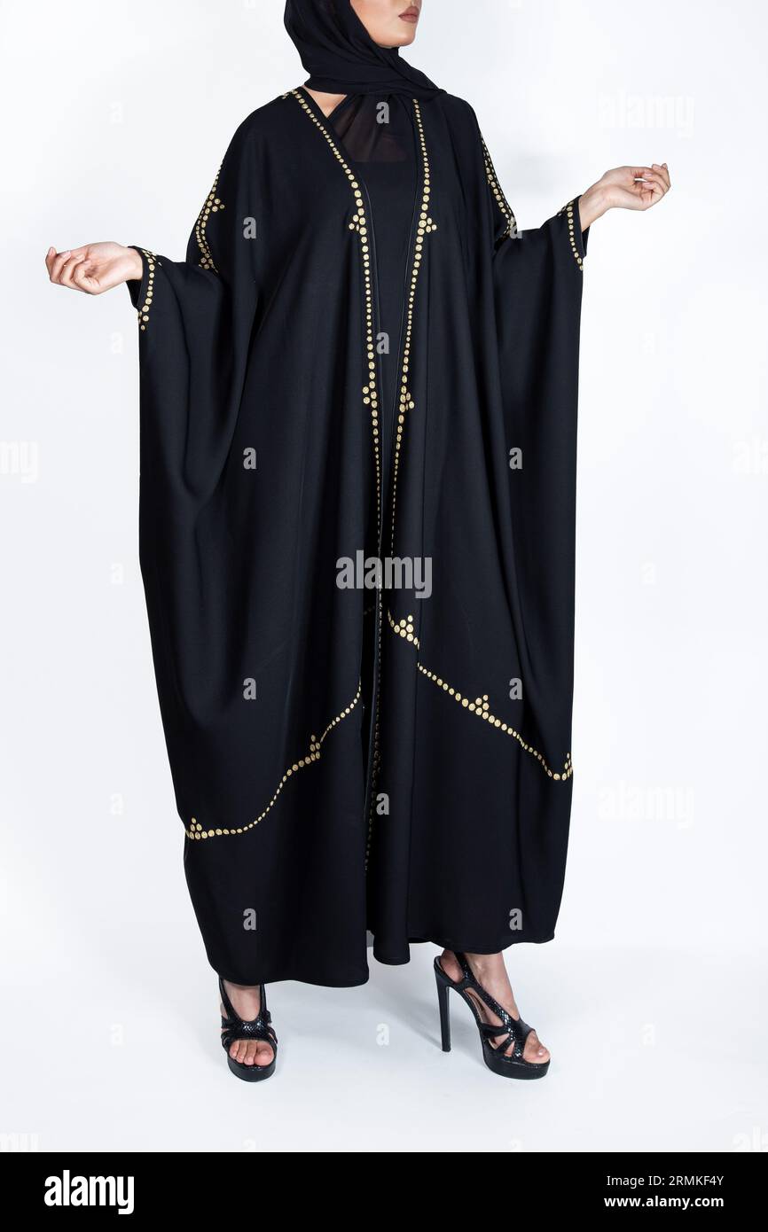 Asian Model poses for Arabic designer Abaya on isolated background ...