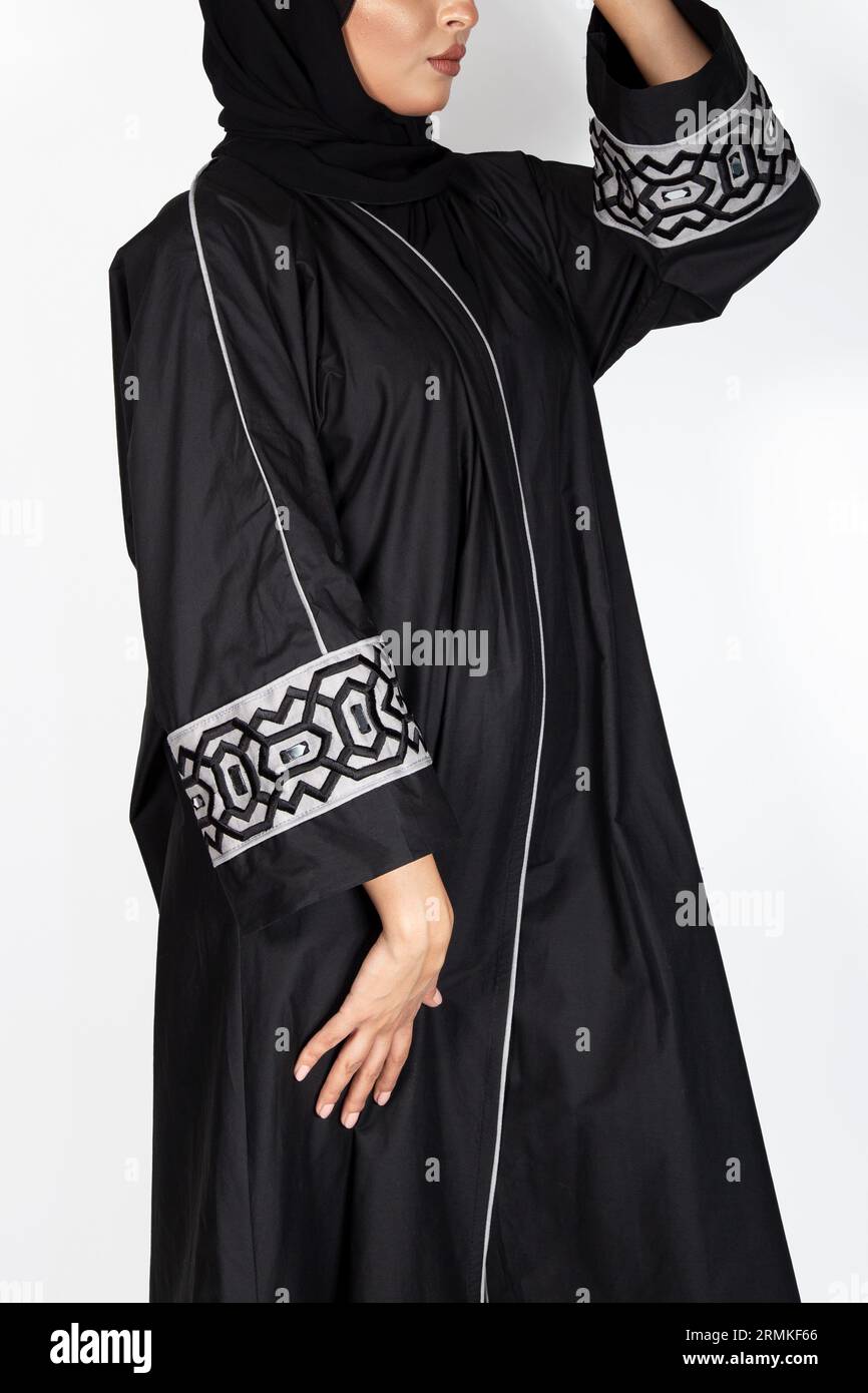 Asian Model poses for Arabic designer Abaya on isolated background ...
