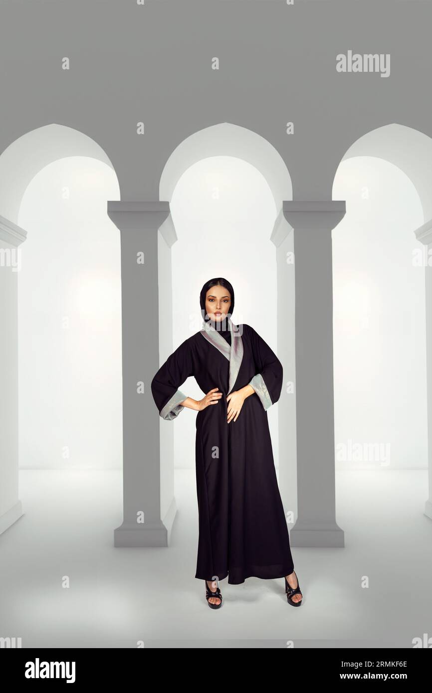 Asian Model poses for Arabic designer Abaya on isolated background ...