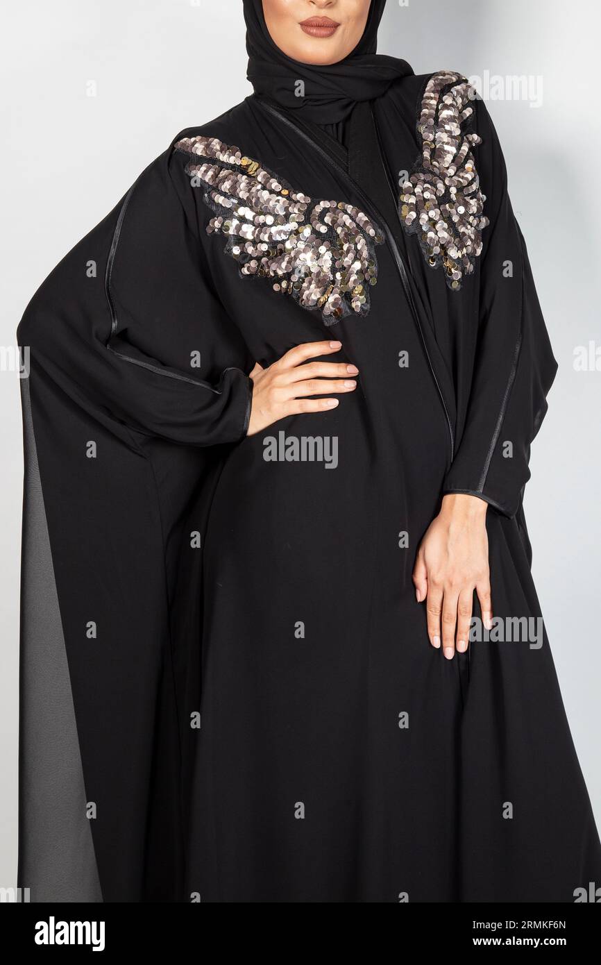 Asian Model poses for Arabic designer Abaya on isolated background ...
