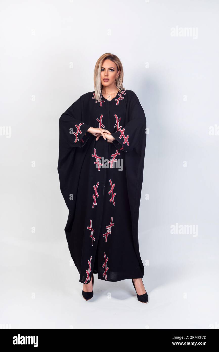 Asian Model poses for Arabic designer Abaya on isolated background ...